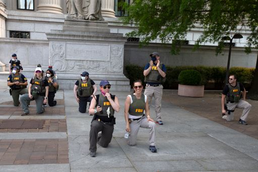FBI fires agents pictured kneeling during racial justice protest in ...
